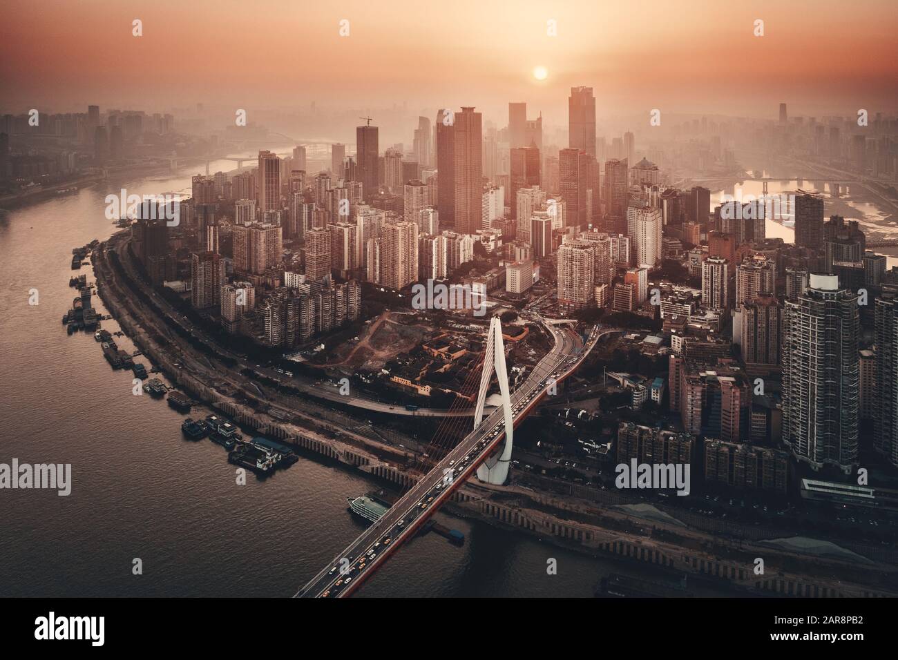 Aerial view of urban buildings and city skyline in Chongqing at sunset ...