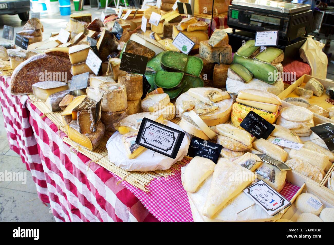 Display of cheeses at an outdoor market in Aix-en-Provence, France ...