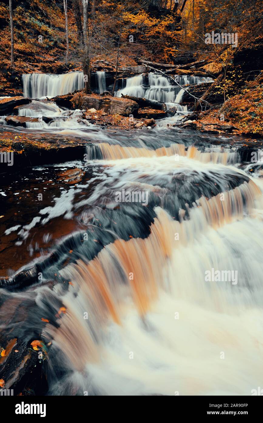 Autumn waterfalls in park with colorful foliage Stock Photo - Alamy