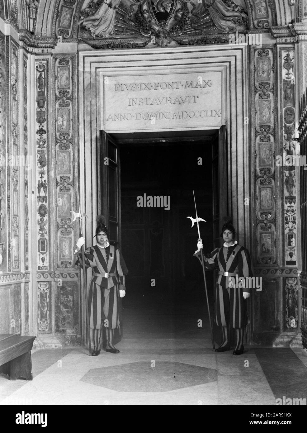 Rome: The Pontifical Swiss Guard in Vatican City Two guards at a gate ...