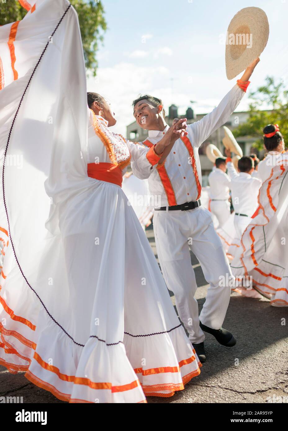 Dancing couple in a new year street festival in Riobamba, Ecuador Stock ...
