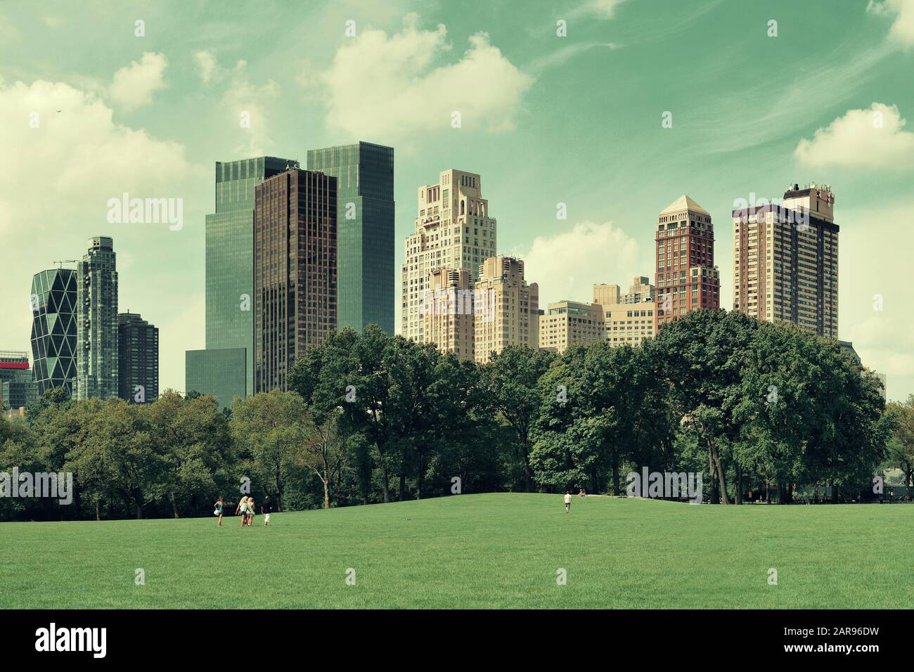 Central Park Spring with skyline in midtown Manhattan New York City ...
