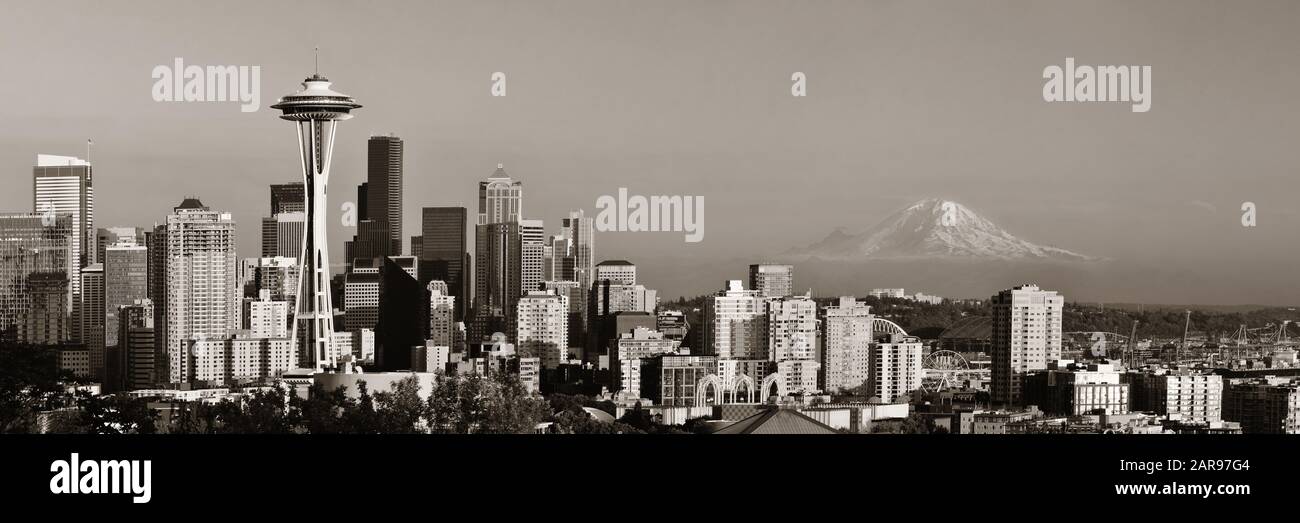Seattle city skyline with Mt Rainier at sunset with urban office ...
