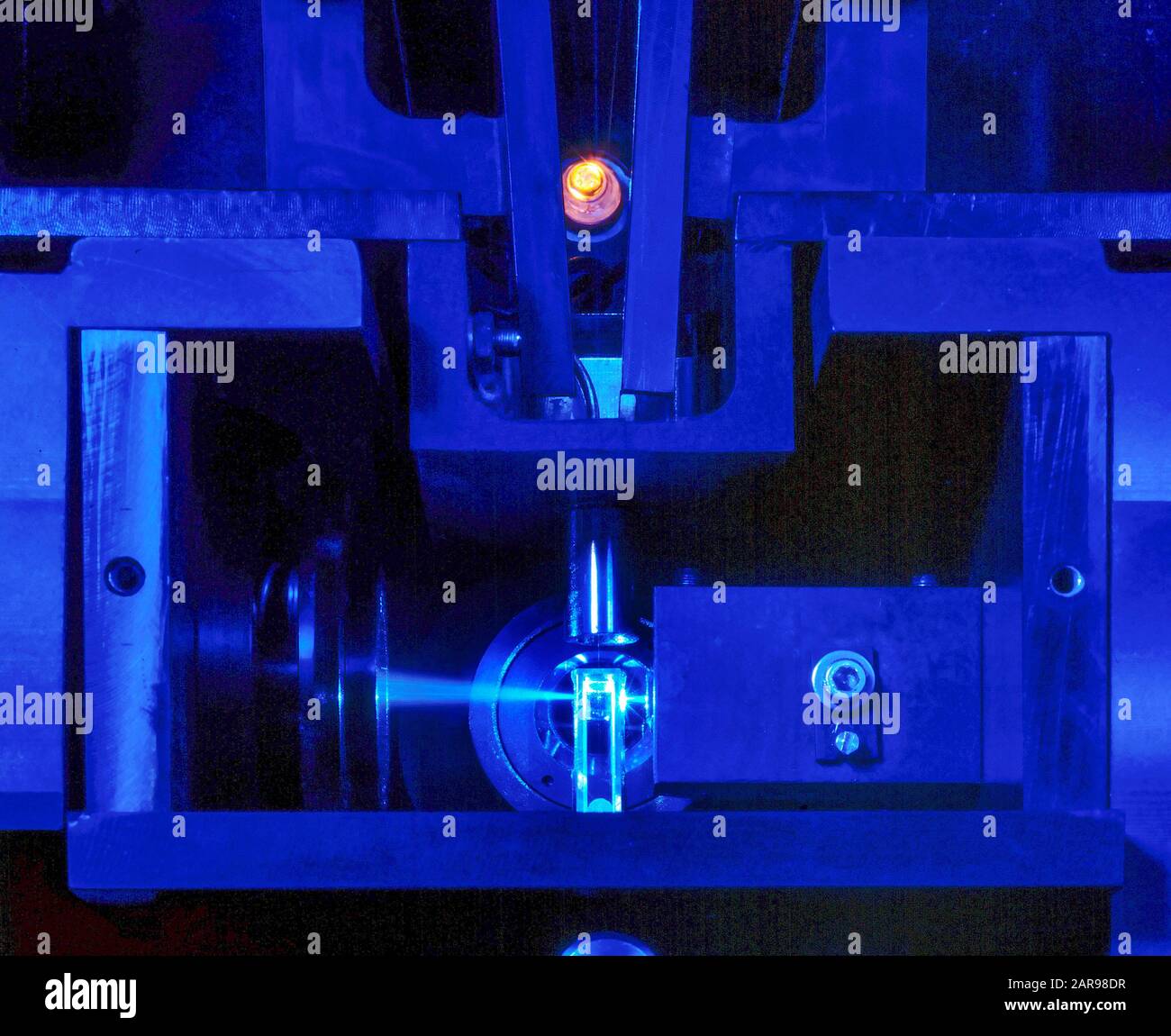 A medical laser beam counts individual blood cells running through a ...