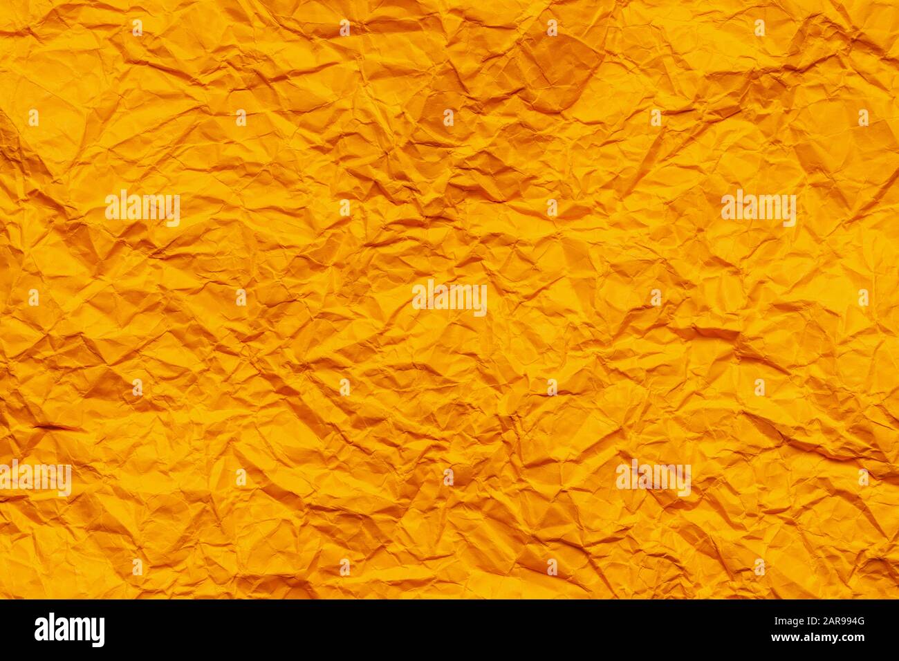 Orange crumpled paper background Stock Photo - Alamy