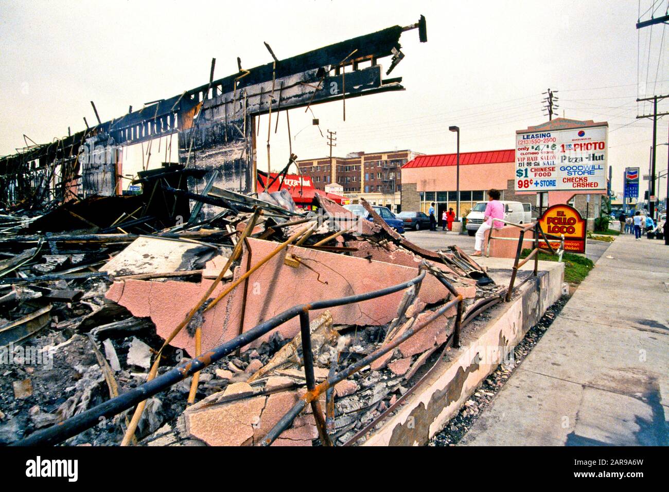 One side of a strip mall in Los Angeles is gutted by fire during the ...