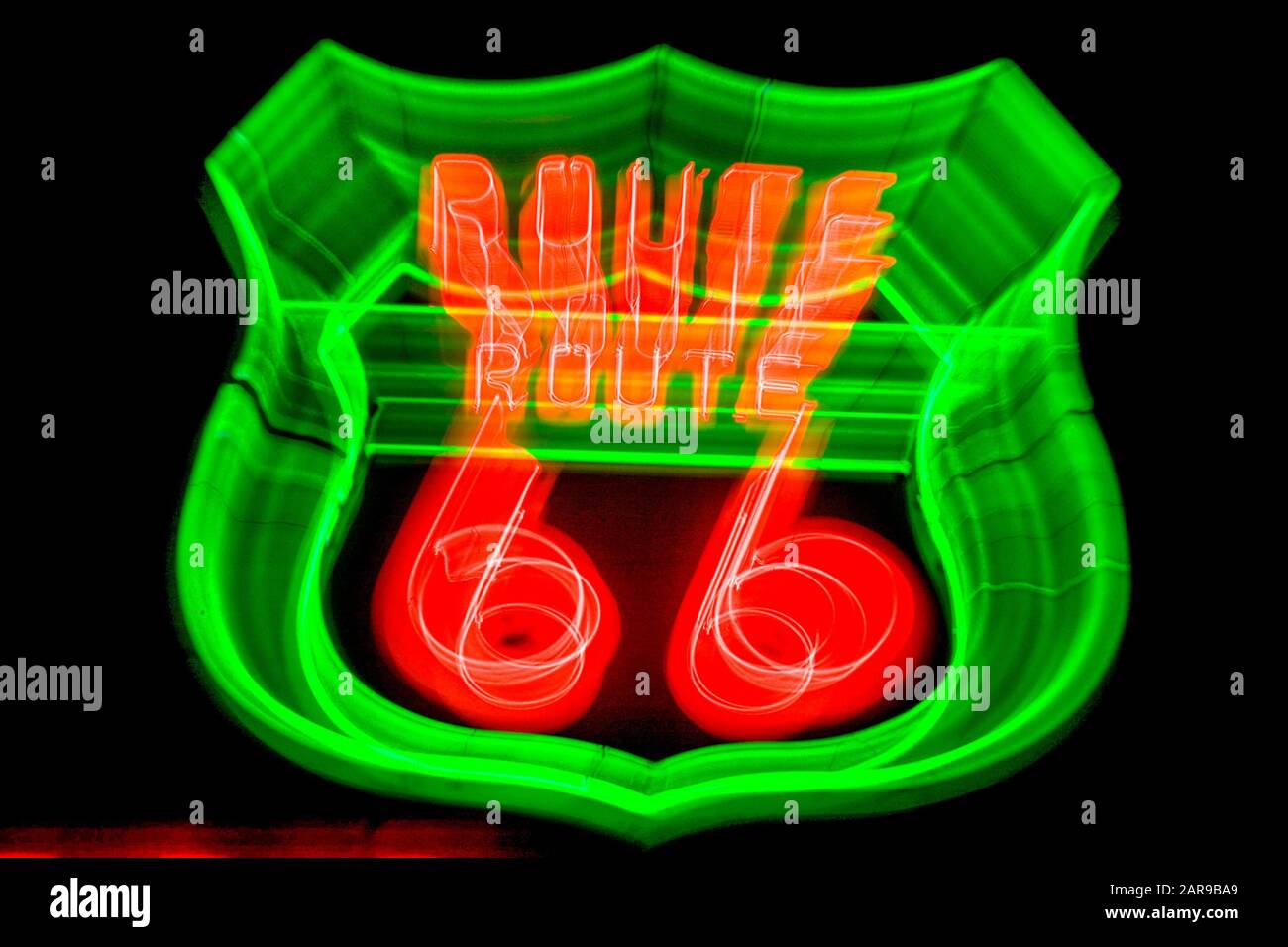 A night zoom-lens abstract of a neon sign on Route 66 in Barstow, CA ...