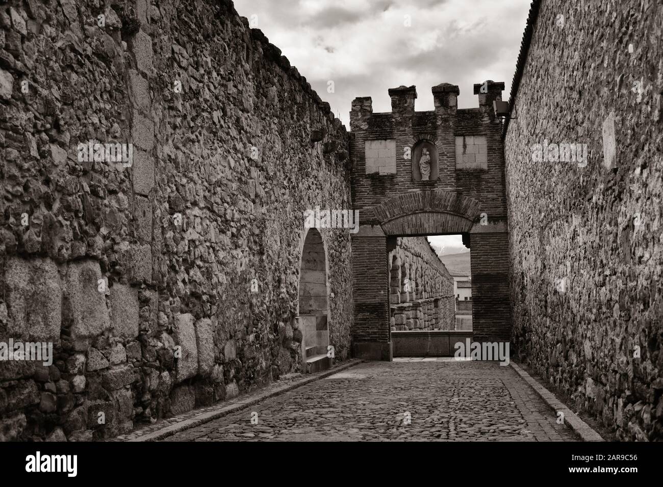 Segovia alley with old buildings street view in Spain Stock Photo - Alamy