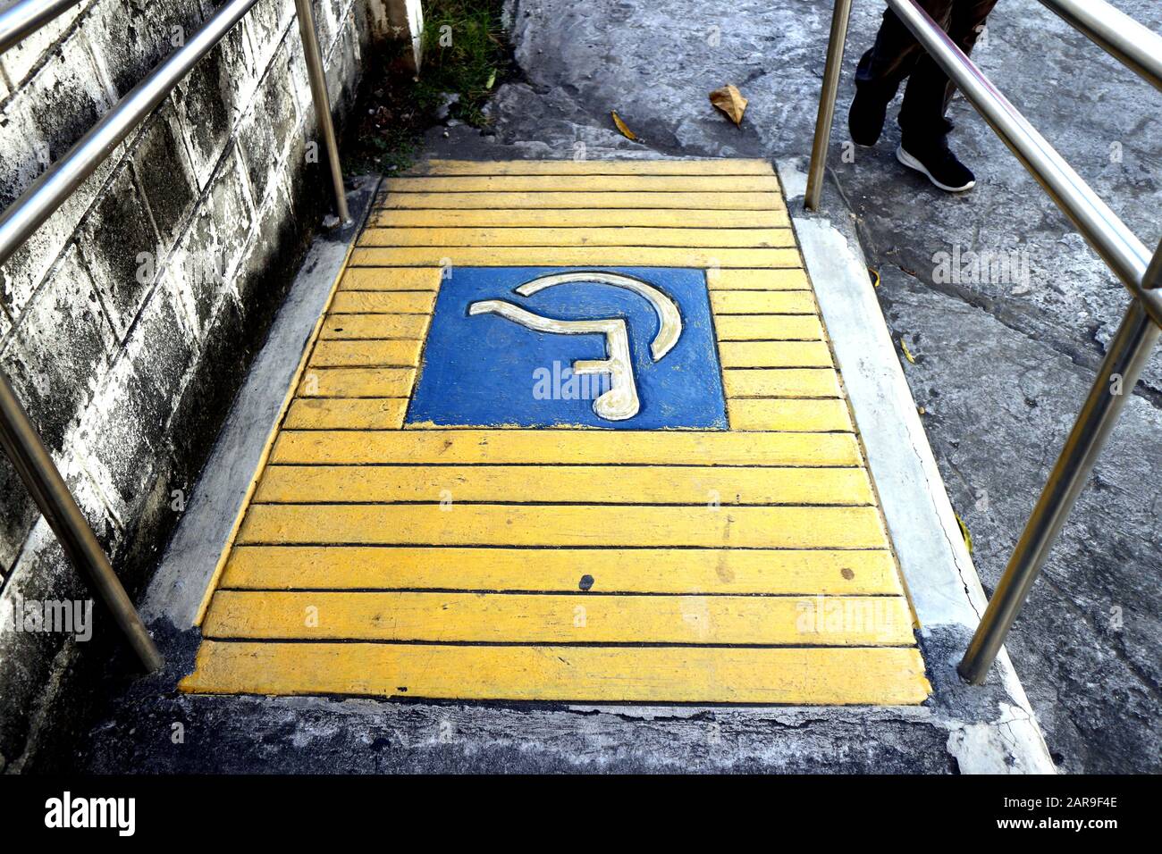 Photo of a PWD or Person with Disability ramp on a sidewalk Stock Photo ...