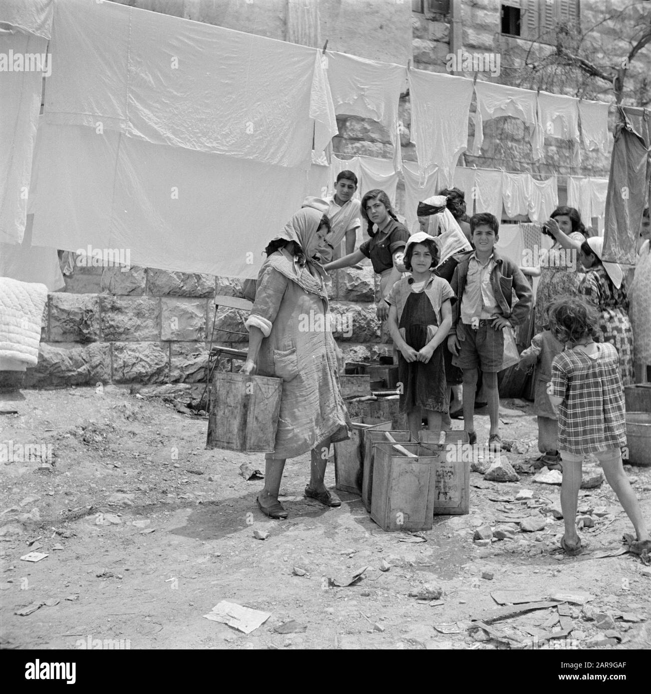 Israel 1948-1949: Jerusalem Women and children at a water source, under ...