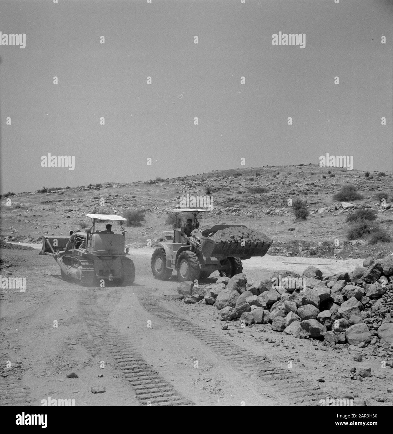 Road construction. Garage machines at work Date: January 1, 1960 ...