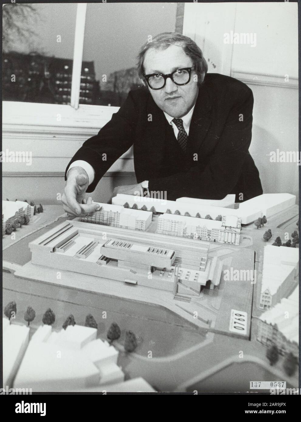 Portrait of architect Wilhelm Holzbauer. On the table model of earspr ...