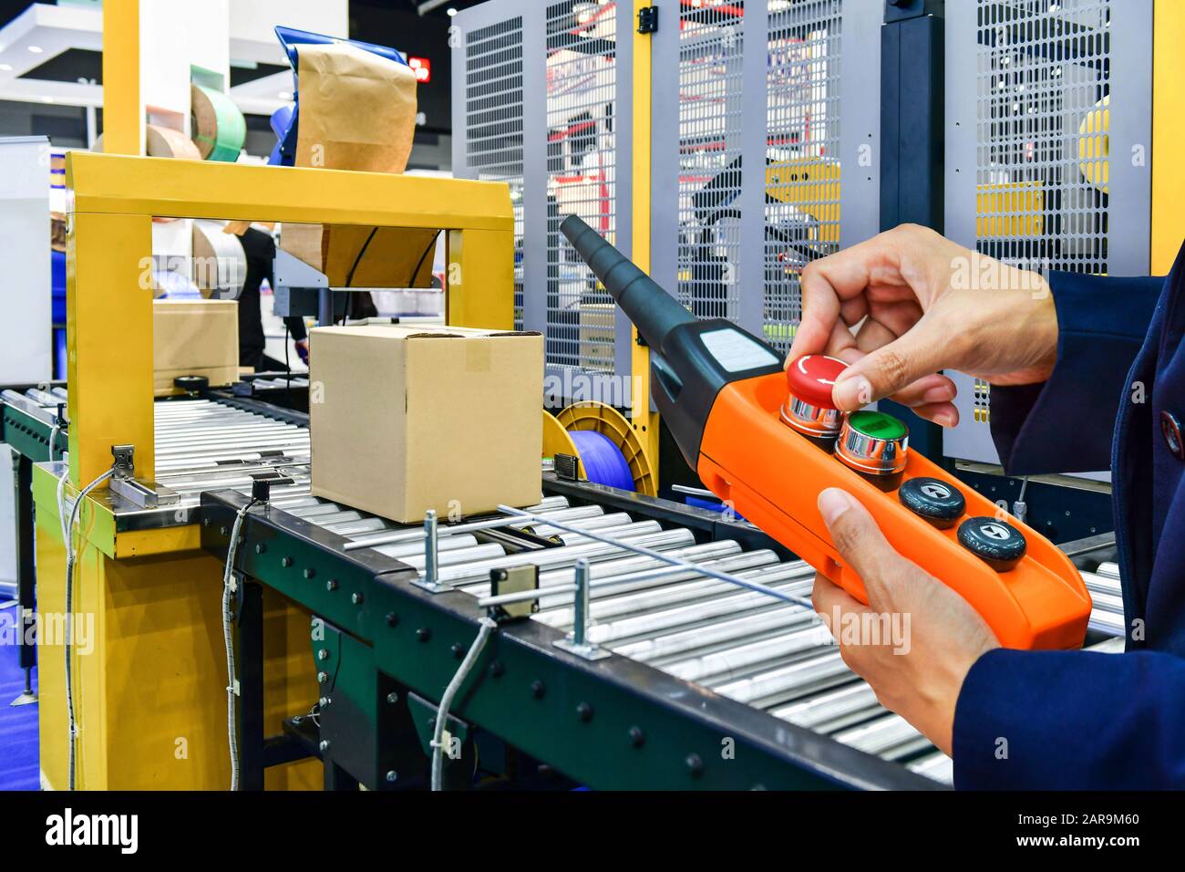 Manager check and control automation cardboard boxes on conveyor belt ...
