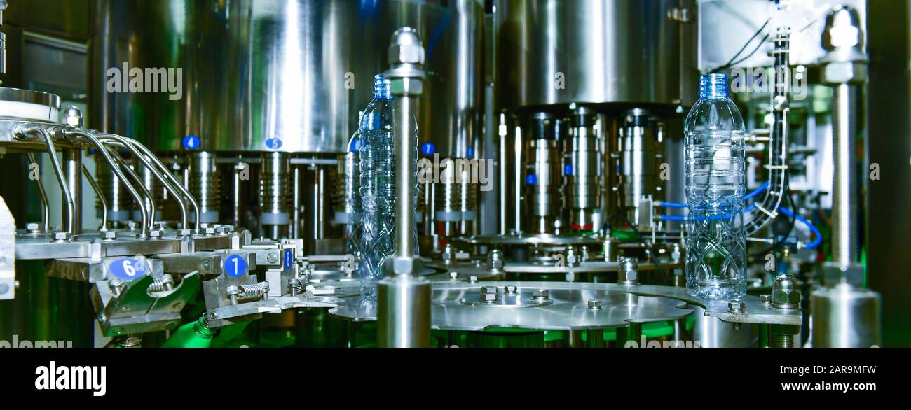 Clear plastic Bottles transfer on Automated conveyor systems industrial ...