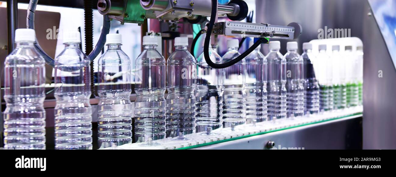 Clear plastic Bottles transfer on Automated conveyor systems industrial ...