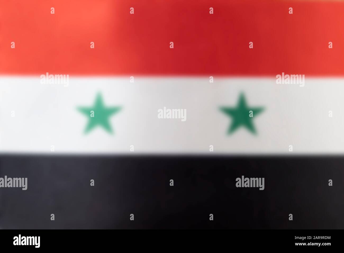 Syria flag blurred. Texture or background. Copy space Stock Photo - Alamy