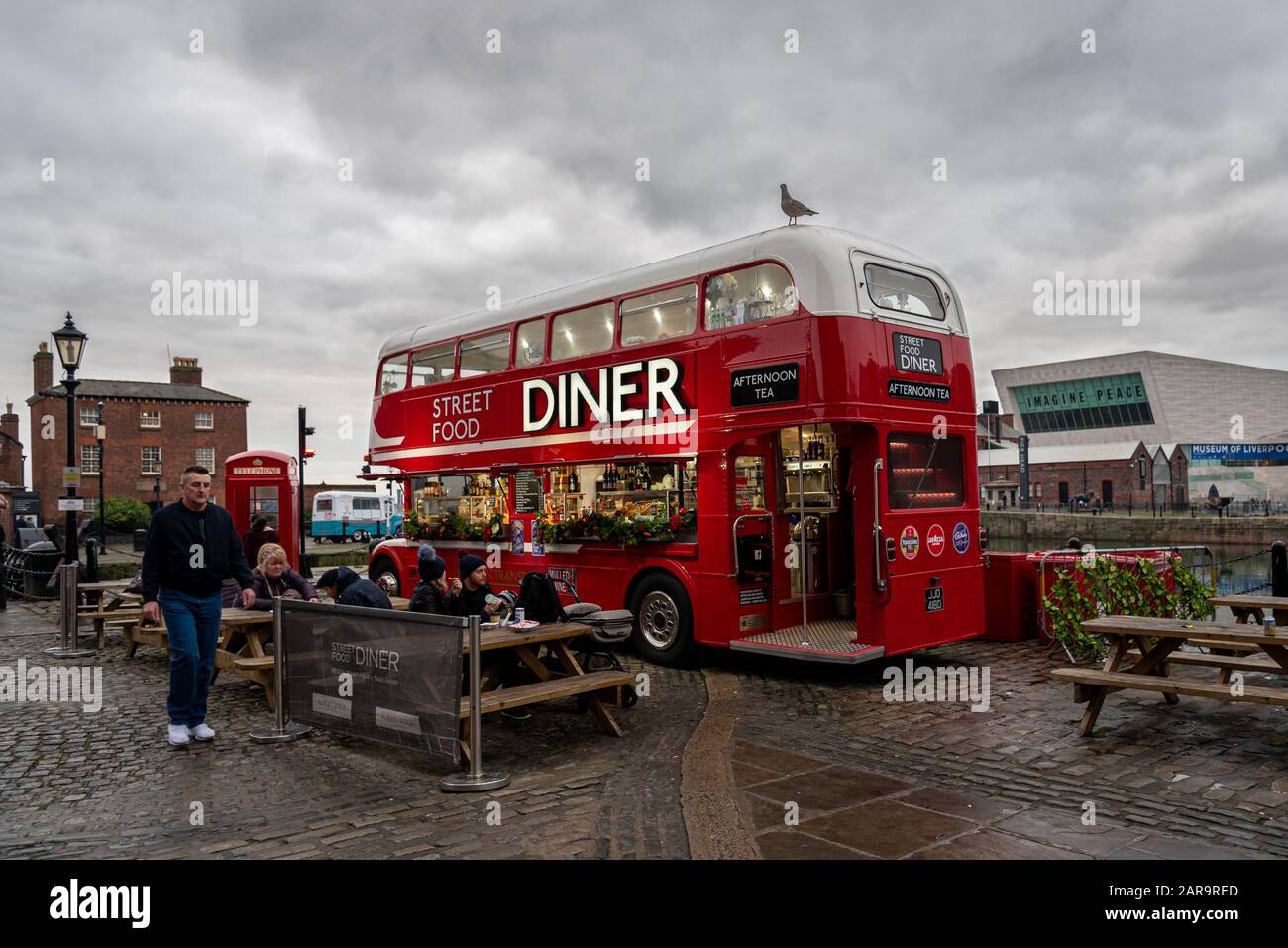 LIVERPOOL, ENGLAND, DECEMBER 27, 2018: People enjoying a meal on a ...