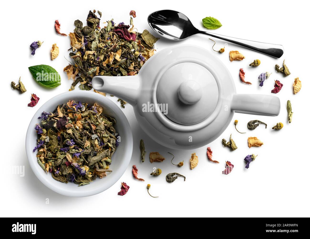 Green tea with natural flavors and a teapot. Top view on white ...