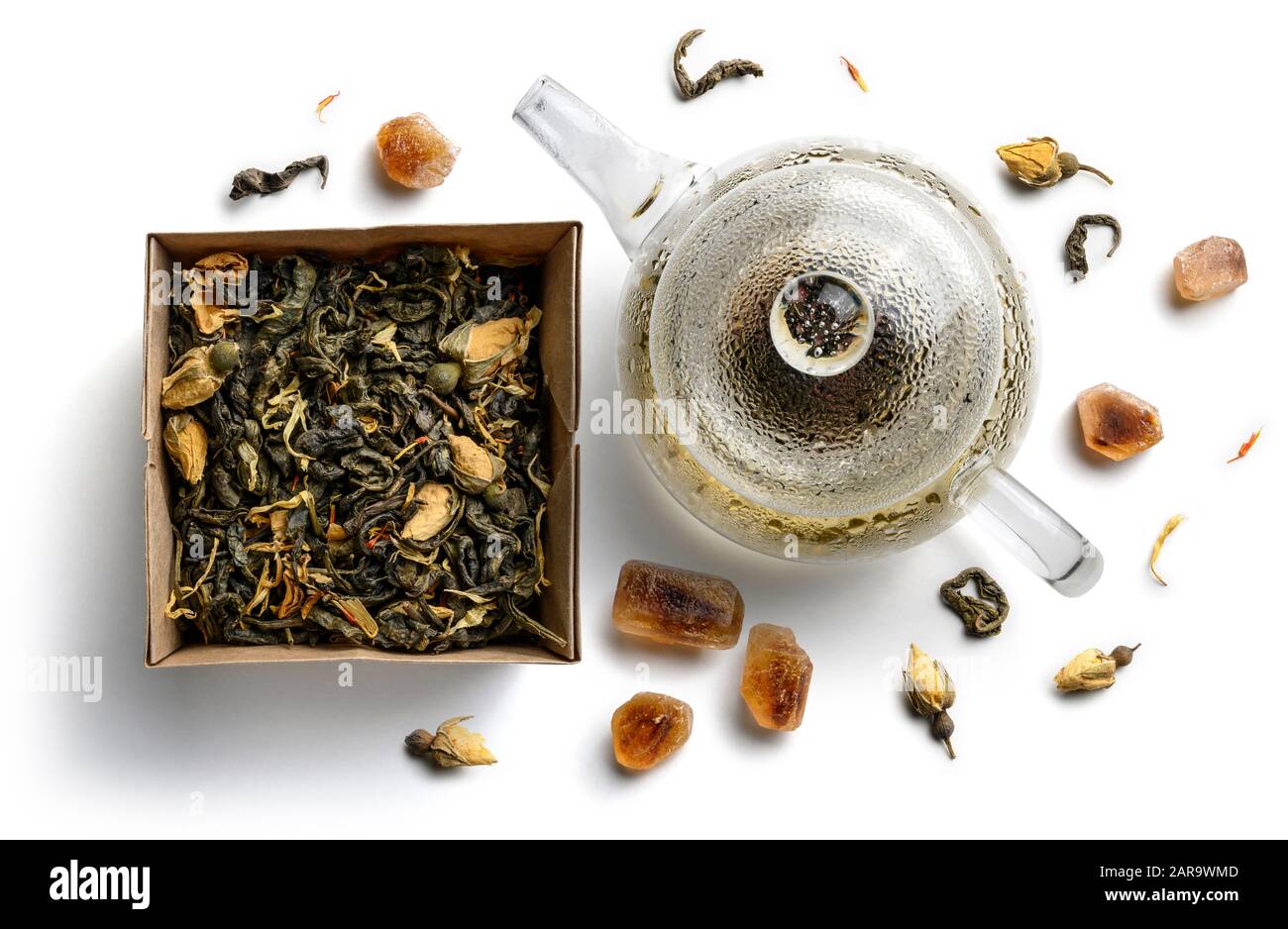 Green tea with natural flavors and a teapot. Top view on white ...