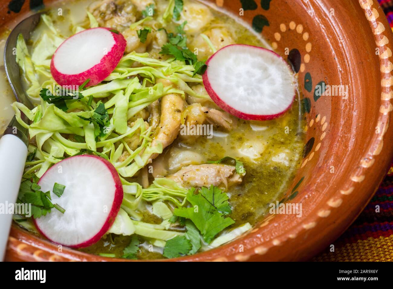 Pozole verde, or green posole is traditionally made with hominy and ...