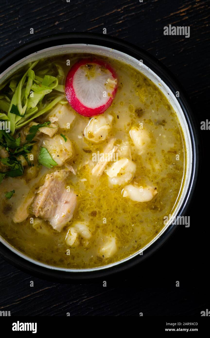 Pozole verde, or green posole is traditionally made with hominy and ...