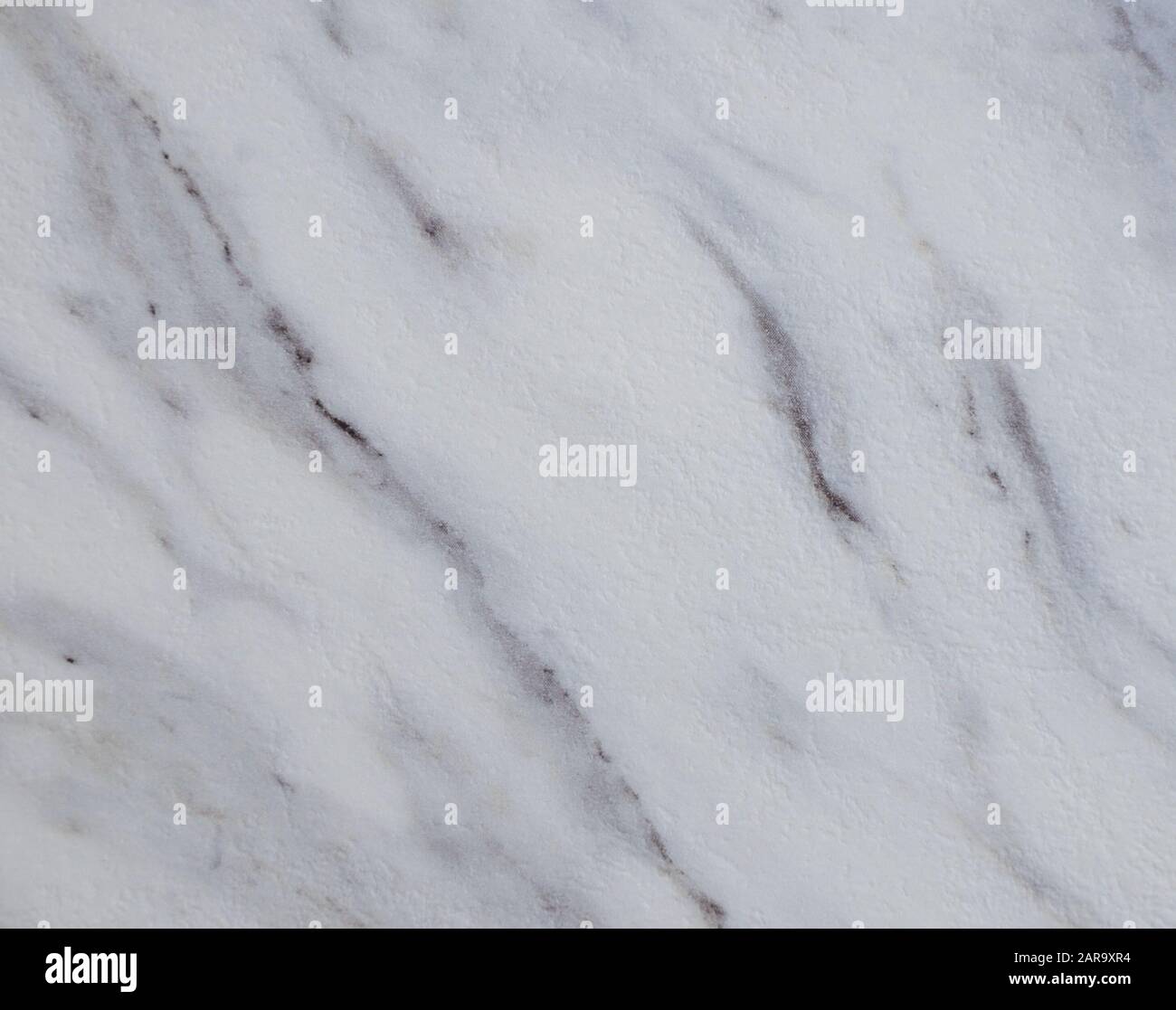 White marble with black veins polished surface of natural stone. Close ...