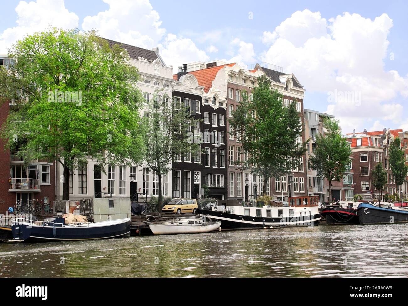 Romantic medieval houses along the river canal in Amsterdam, capital of ...