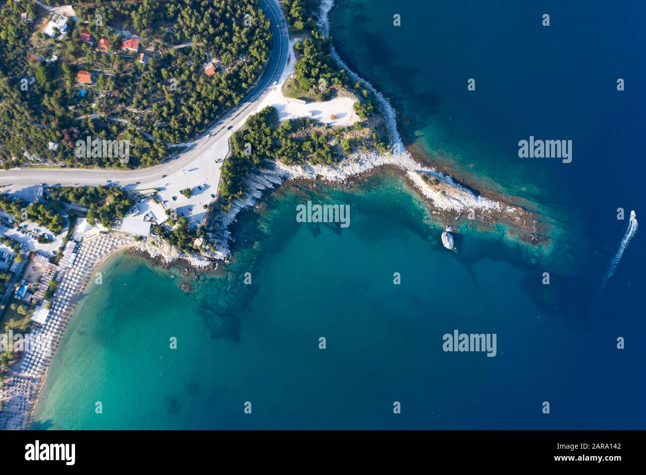 Aerial view from flying drone of a small peninsula with calm turquoise ...