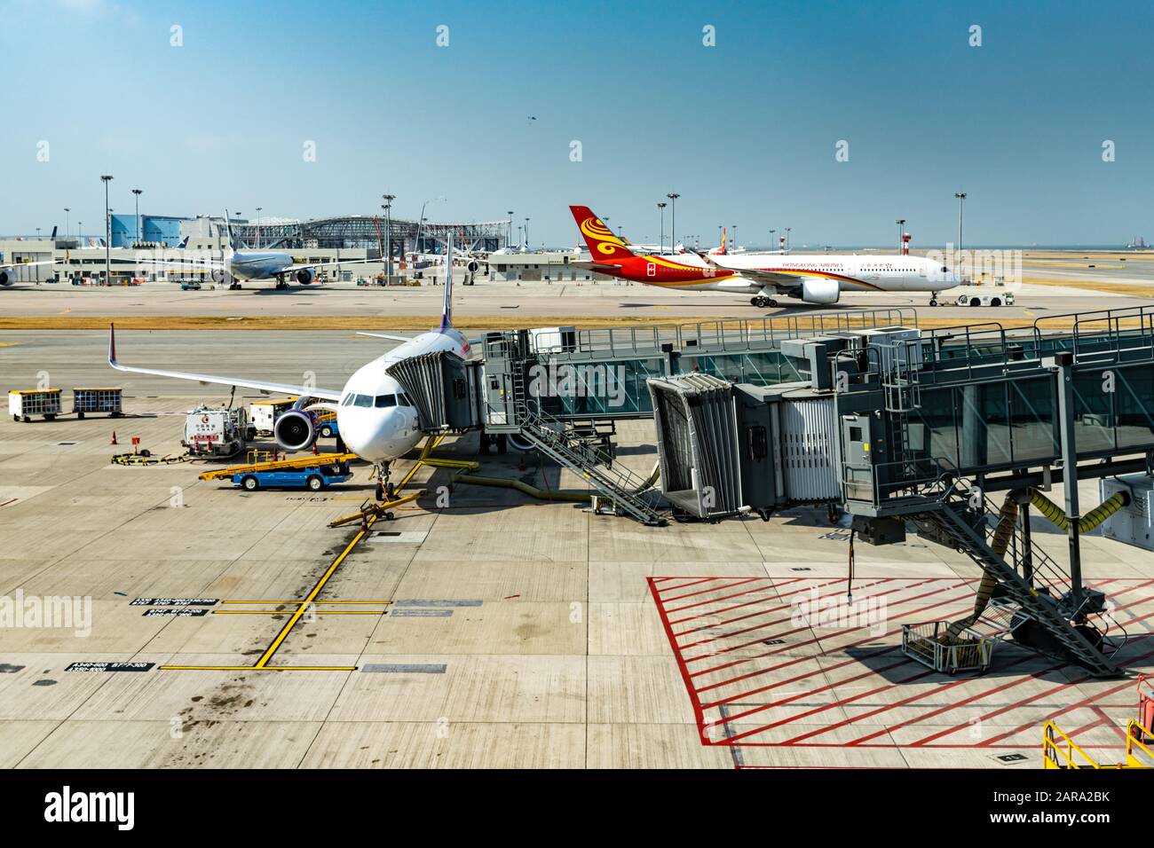 Lantau, Hong Kong - November 16, 2019 : Airplane dock with passenger ...