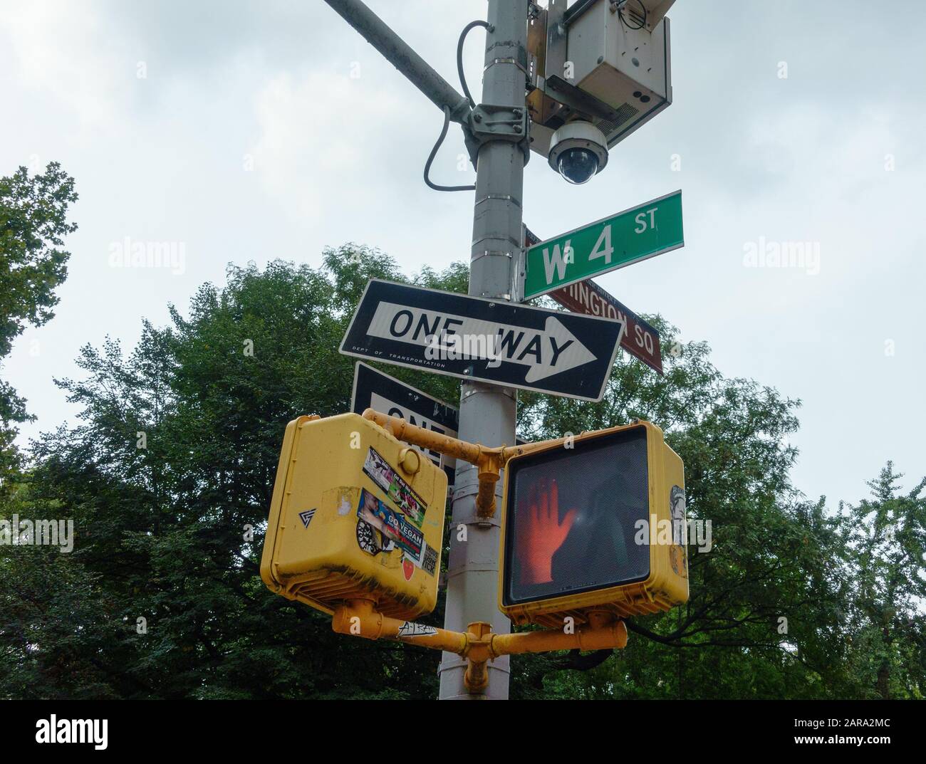 Post with traffic light and road signs Stock Photo - Alamy
