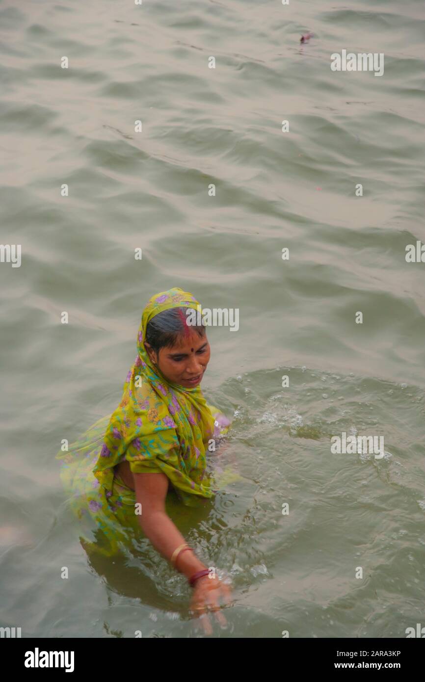 In the morning, Prayer at ghats of holy Ganges river, also Ganga river ...