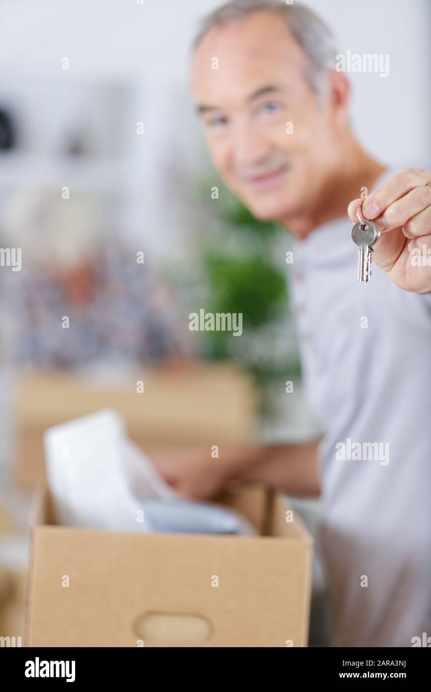 happy man got a key of new housing Stock Photo - Alamy