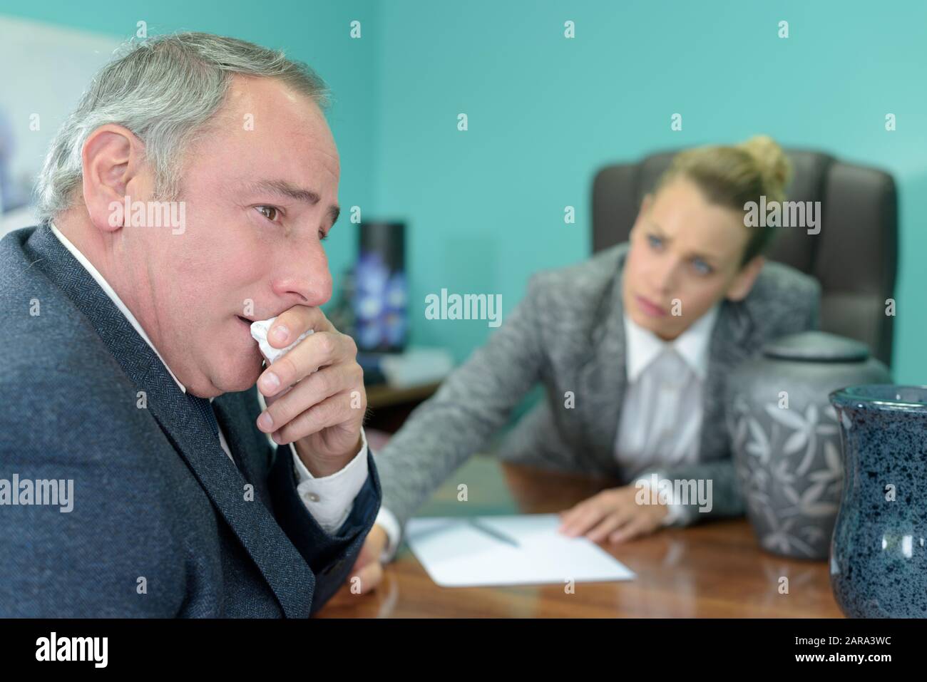 crying man in funeral office Stock Photo - Alamy