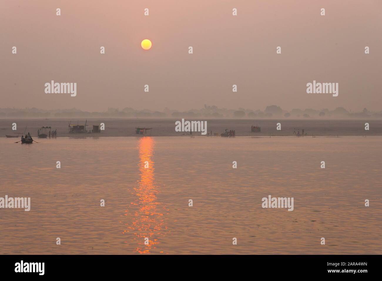 Sunrise on holy Ganges river from ghats, also Ganga river, Varanasi ...
