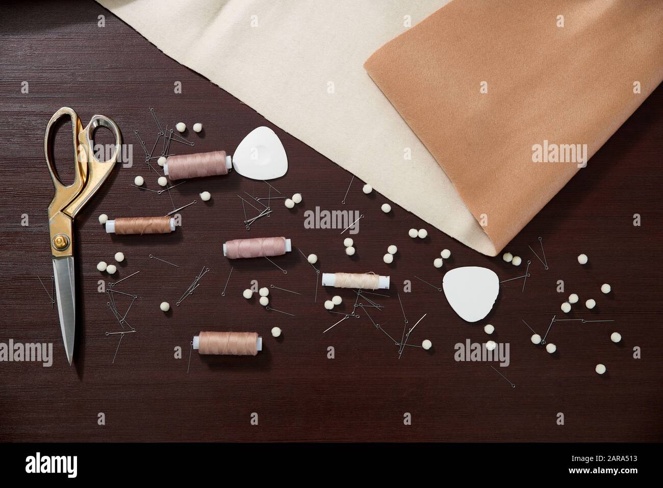 Group of sewing objects lying flat on a black chalkboard background ...