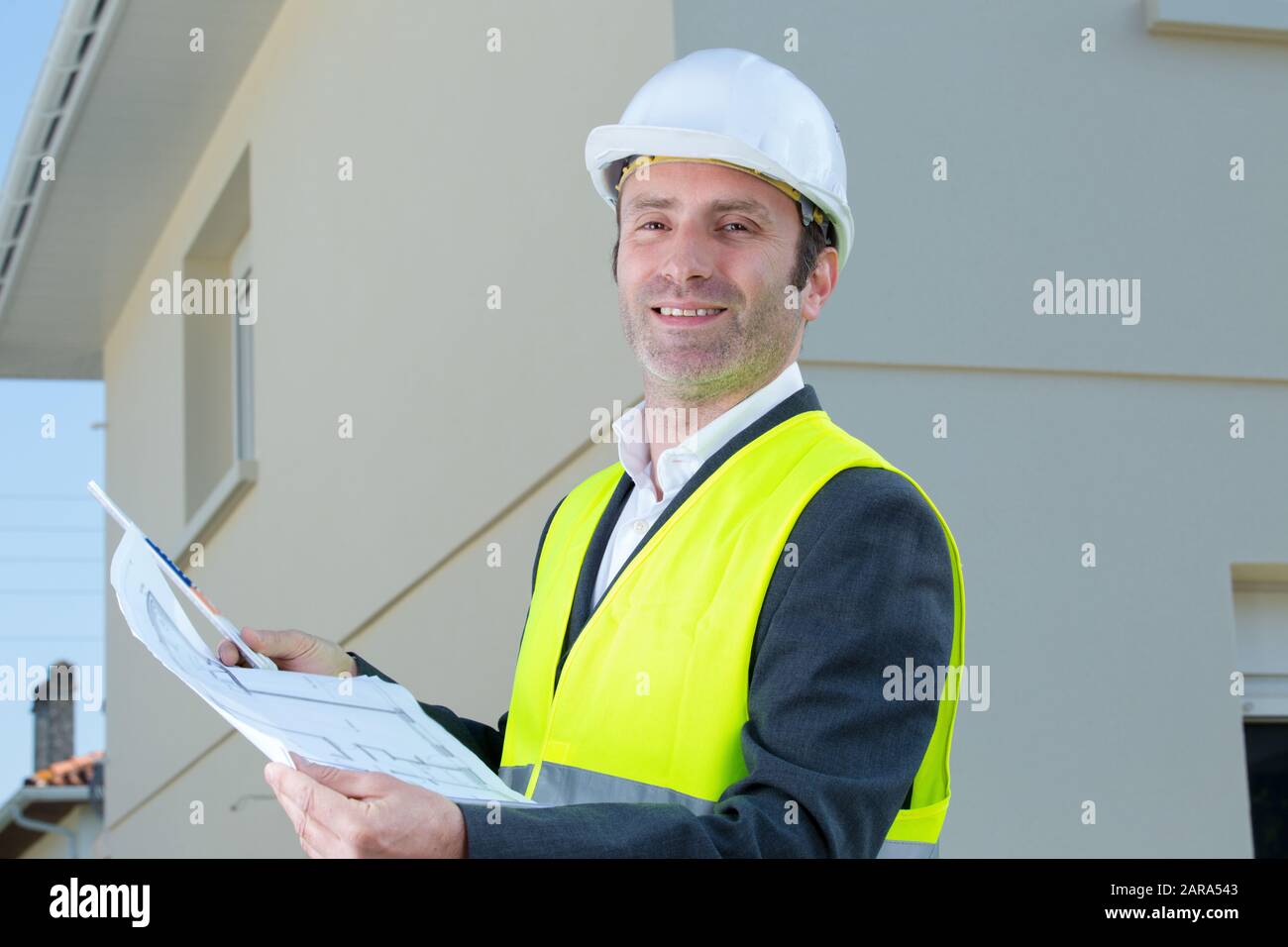 engineer surveying land using blueprint to plan the work Stock Photo ...