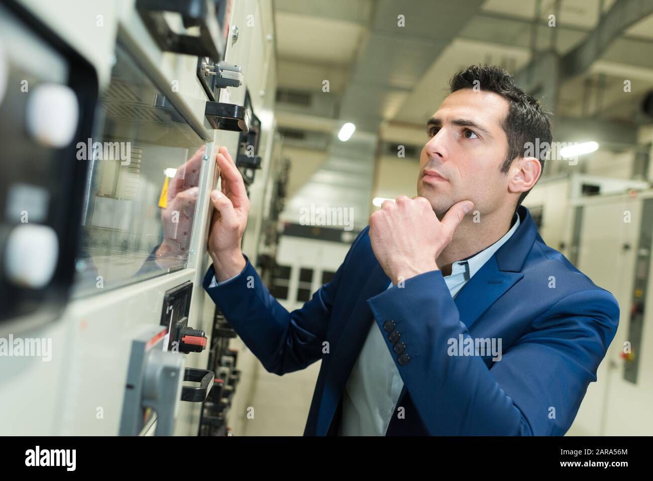handsome guy selecting microwave oven in hypermarket and smiling Stock ...