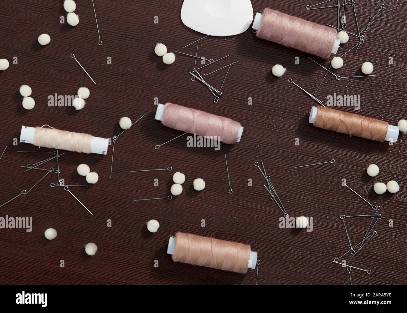 Group of sewing objects lying flat on a black chalkboard background ...