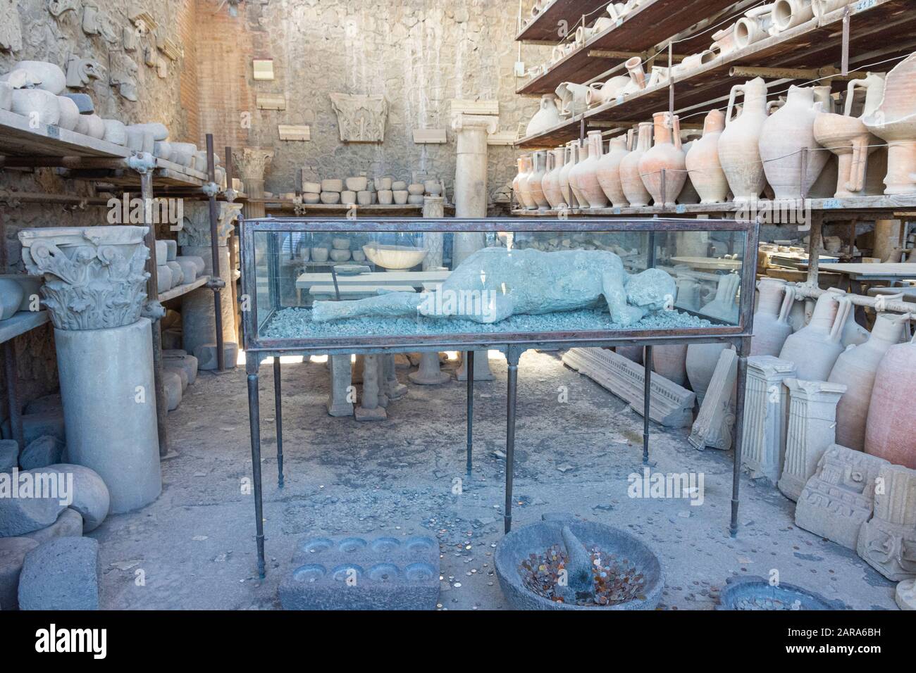 Plaster Cast Of An Inhabitant And Artifacts In The Forum Granary Of The ...