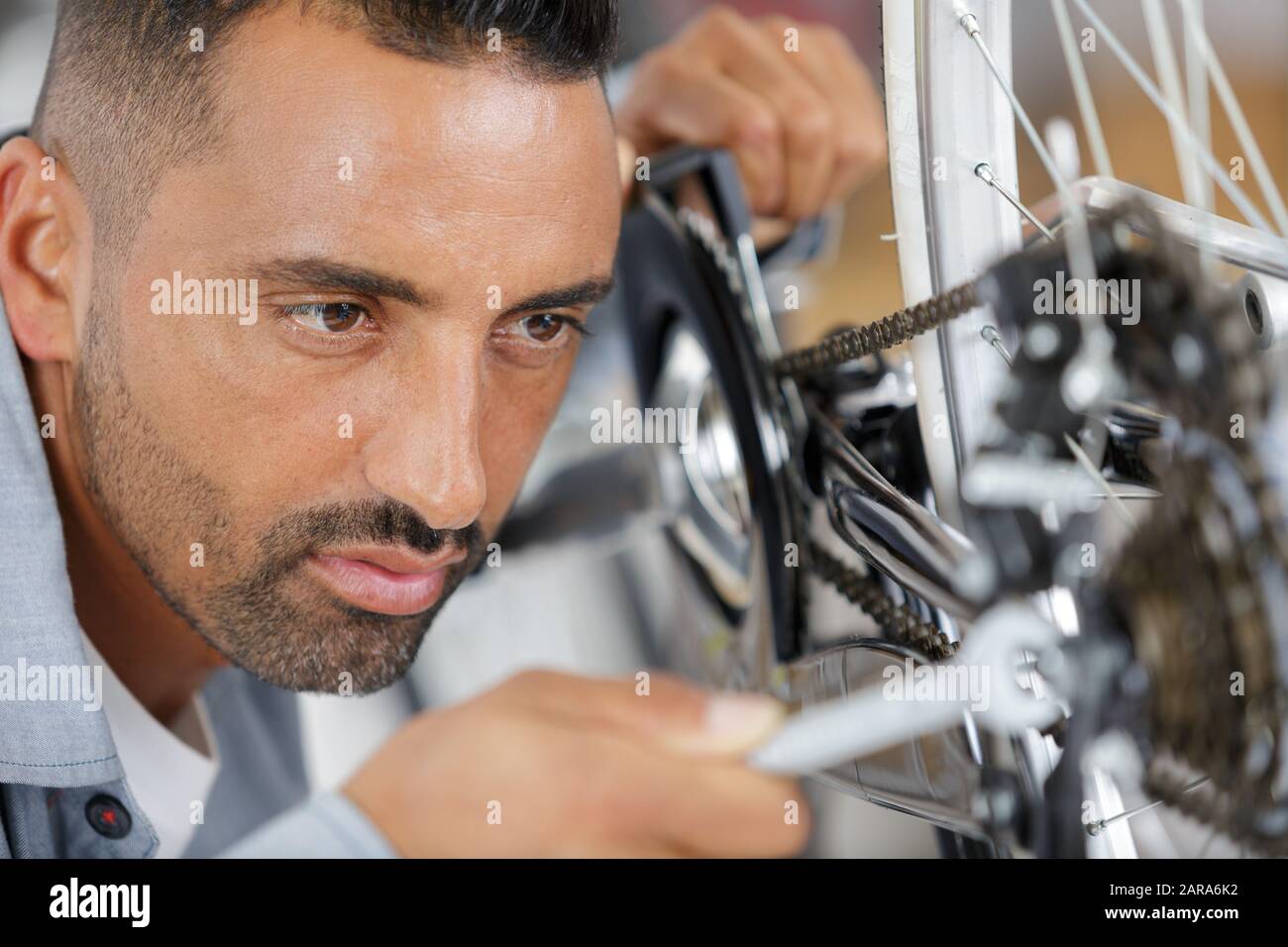 Male cyclist repairing mountain bike hi-res stock photography and ...