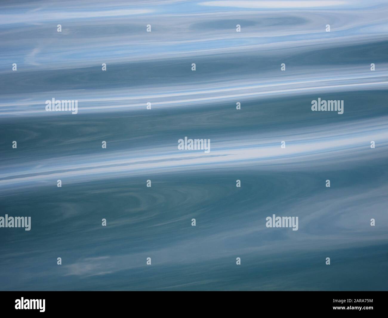 Sea in background with small ripples Stock Photo - Alamy