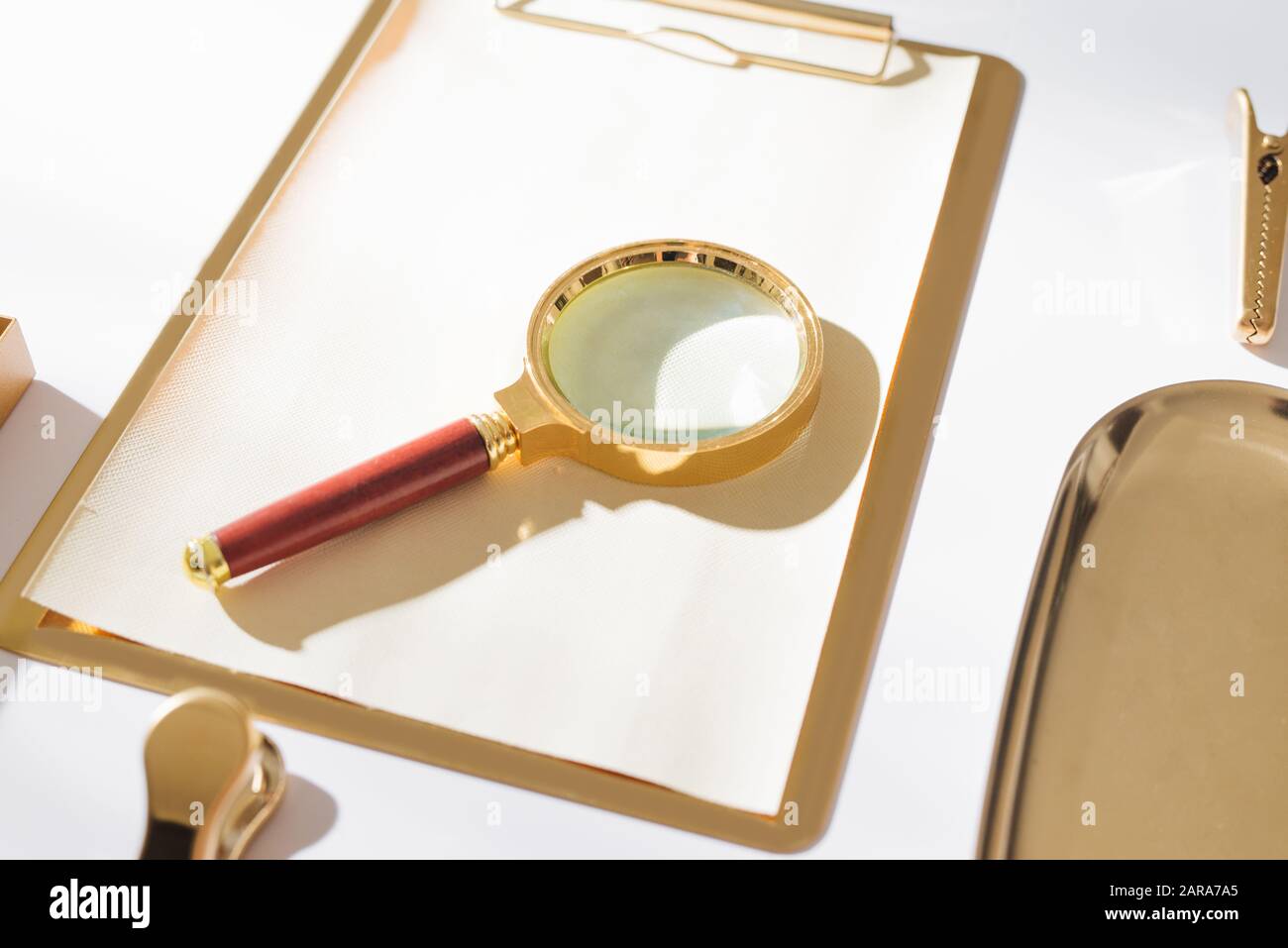 layout of gold stationery on blush white background with copy space ...