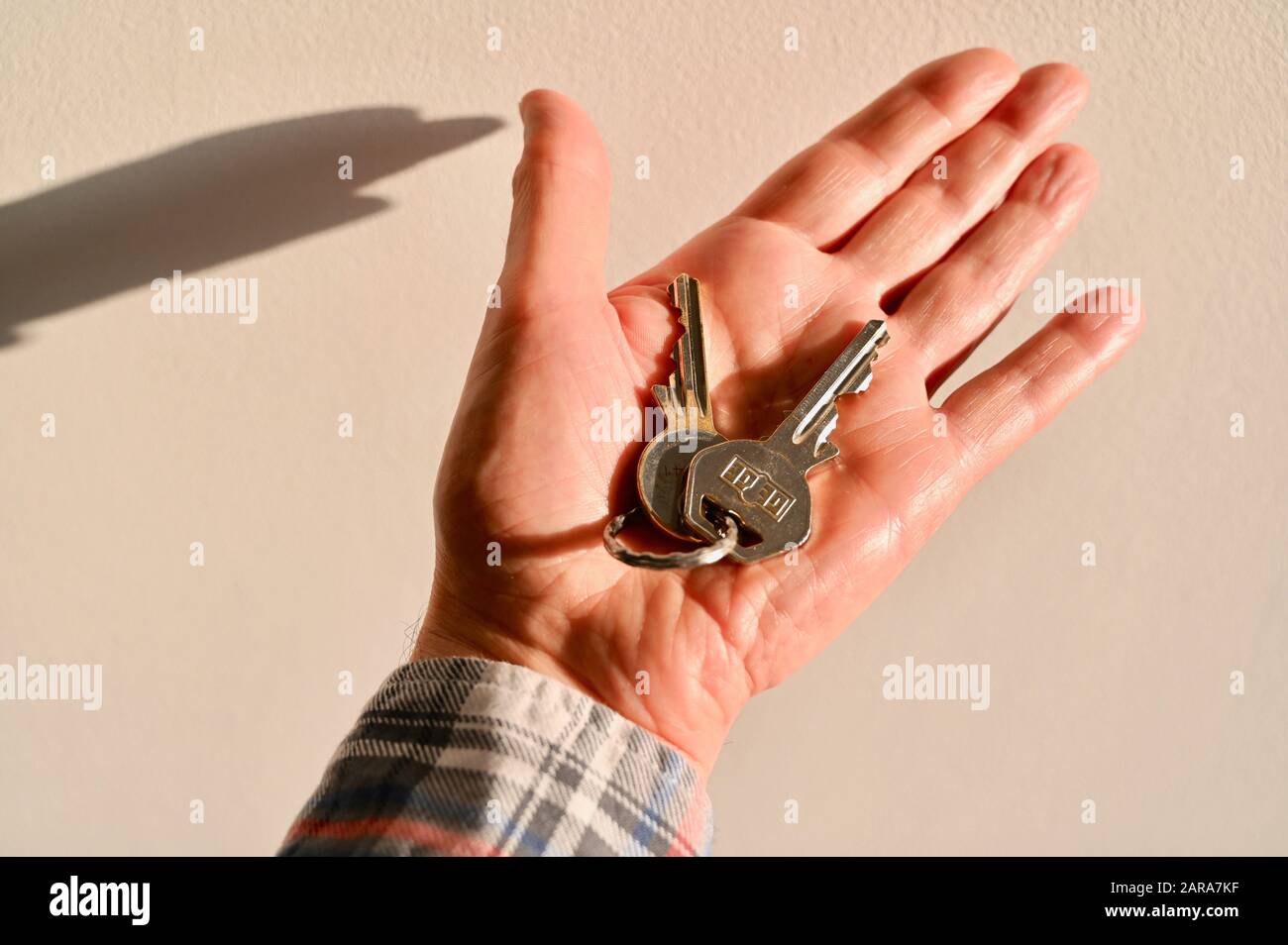 Holding key keys hi-res stock photography and images - Alamy
