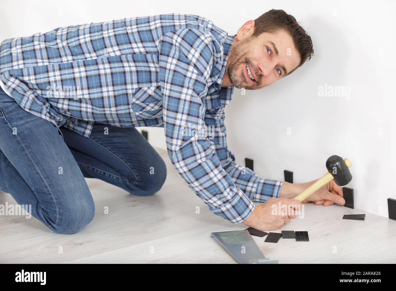 Carpenter during installing laminate hi-res stock photography and ...