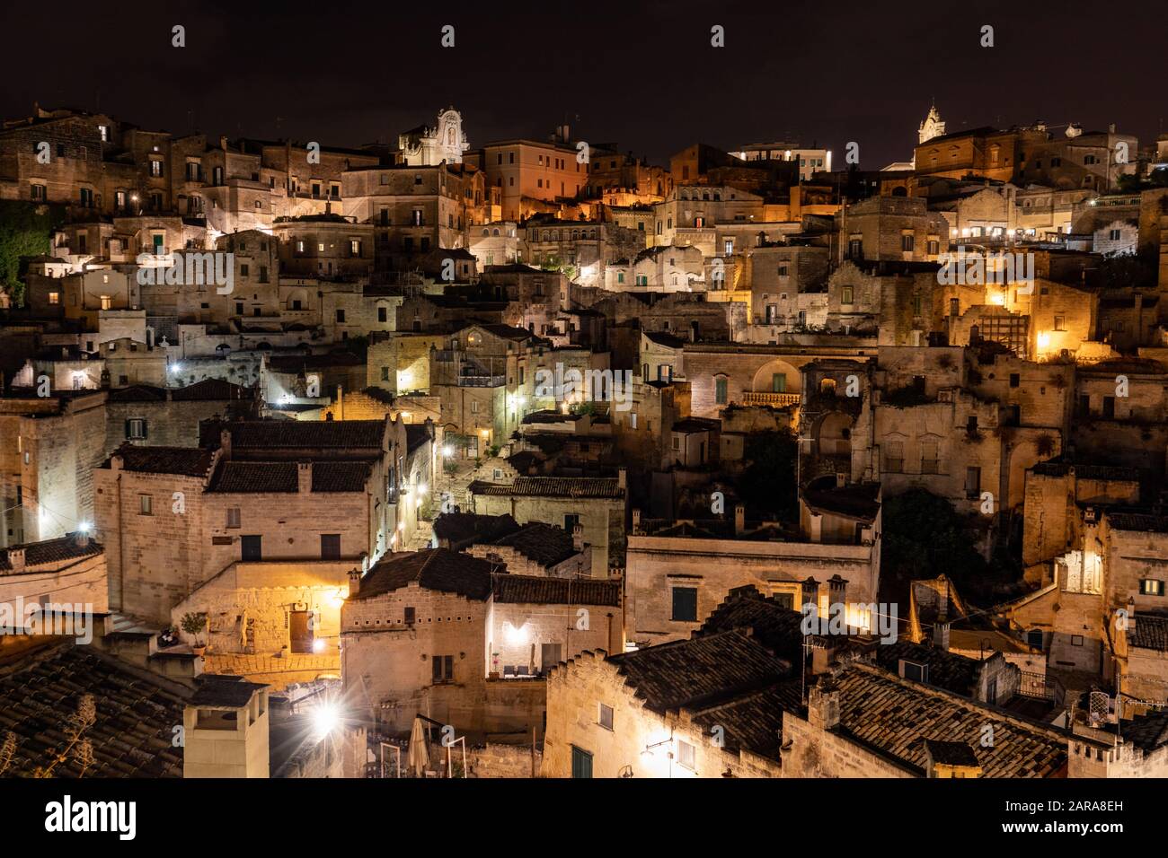 Amazing lighted buildings in ancient Sassi district by night in Matera ...