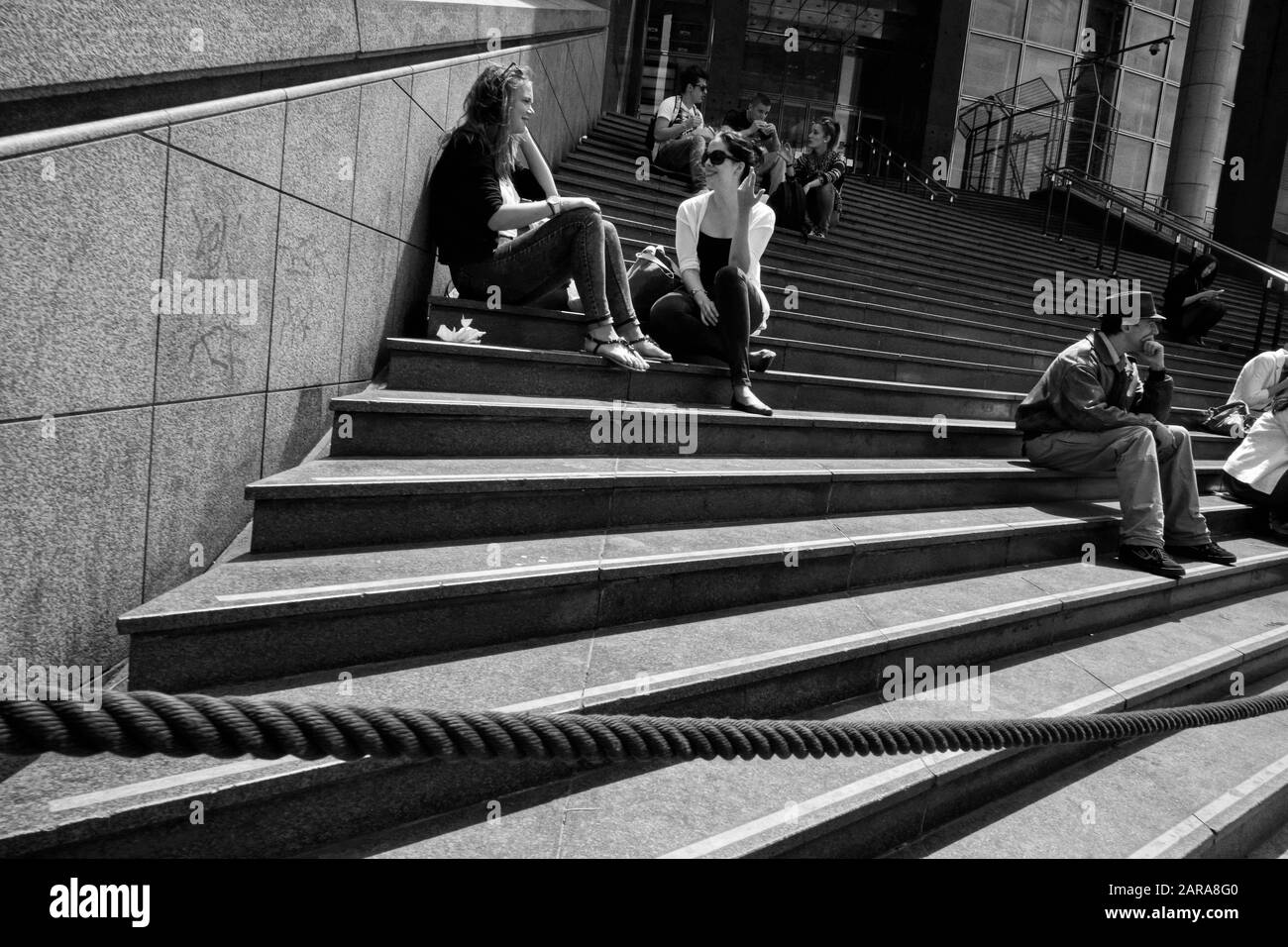 Crowd people sitting on steps Black and White Stock Photos & Images - Alamy