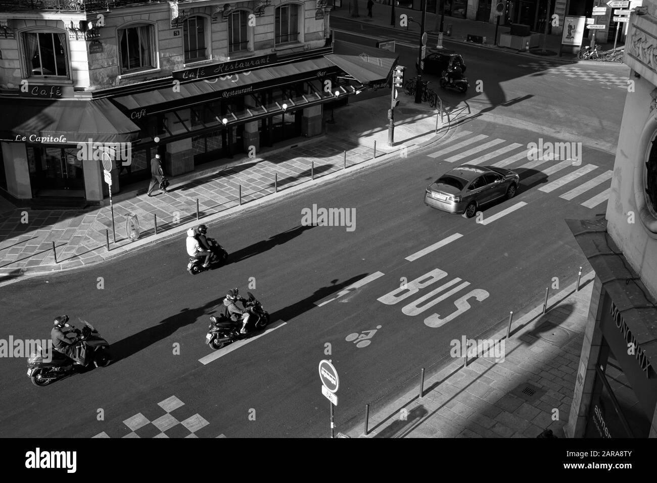 Aerial of bike and car on road, long shadow, Paris, France, Europe ...