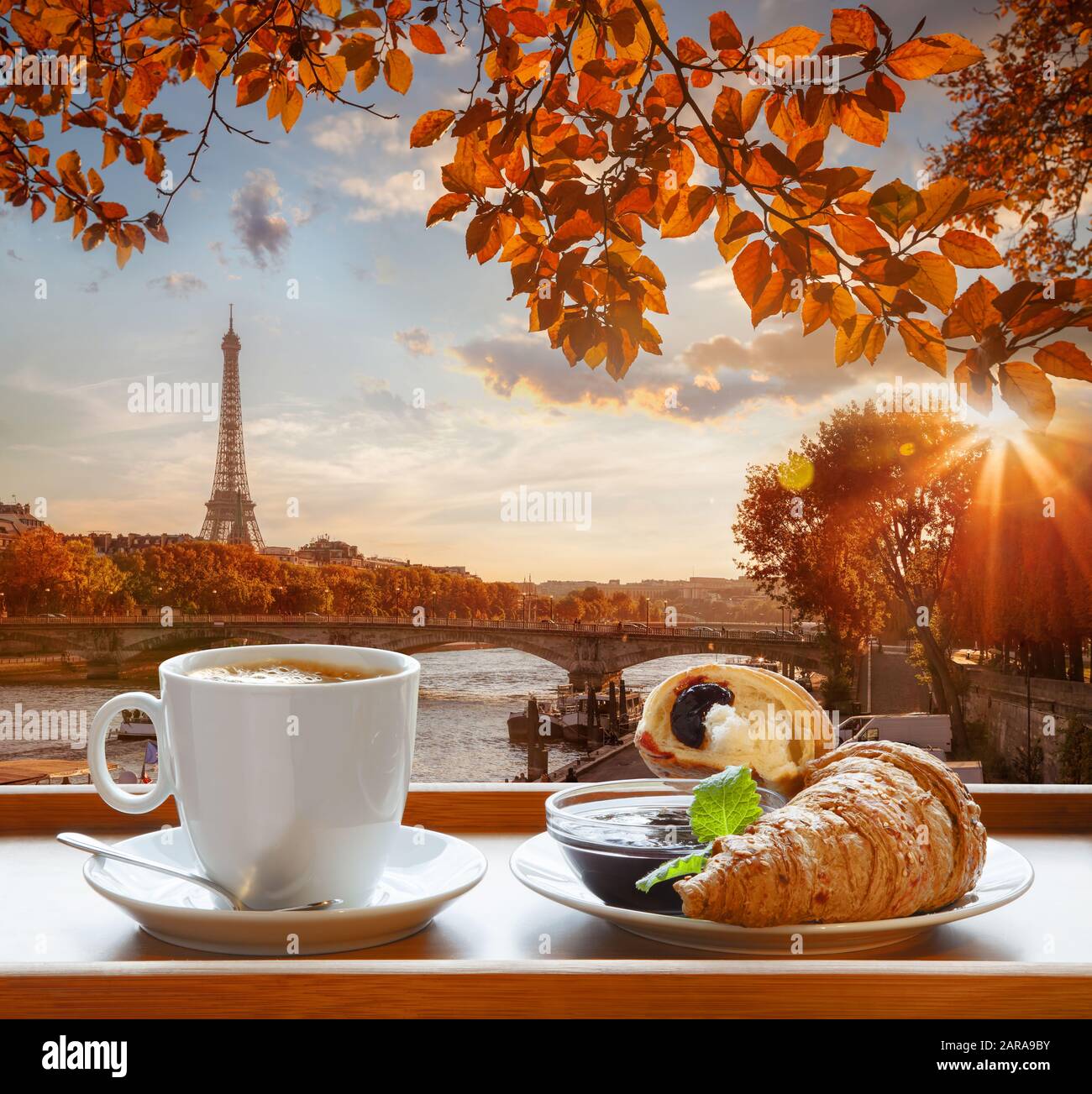 Coffee with croissants against famous Eiffel Tower in Paris, France Stock Photo - Alamy