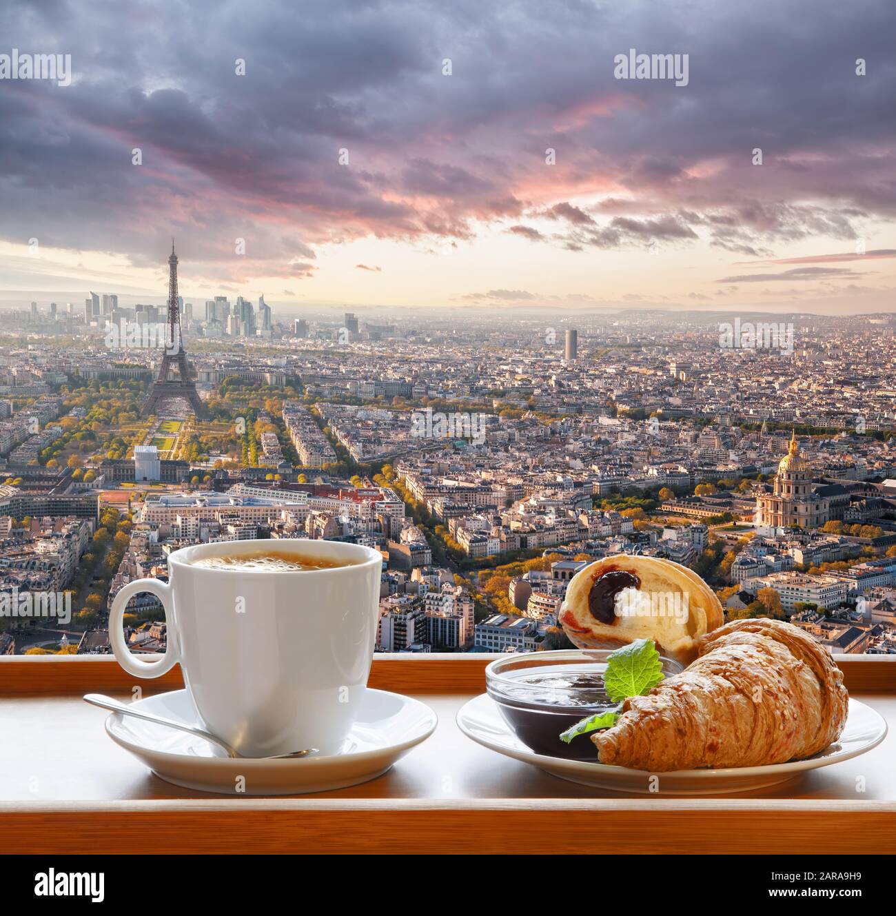 Coffee with croissants against famous Eiffel Tower in Paris, France Stock Photo - Alamy