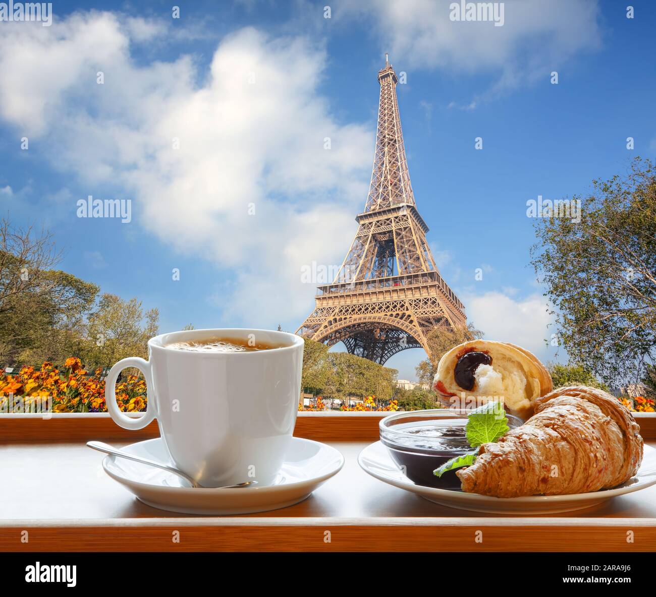 Coffee with croissants against famous Eiffel Tower in Paris, France Stock Photo - Alamy